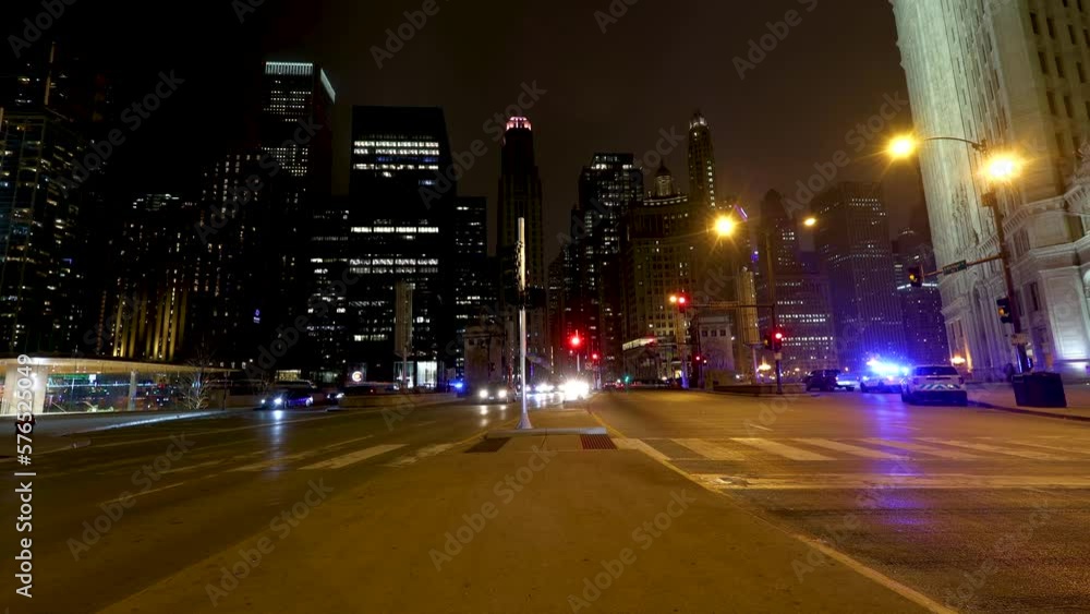 Night time lapse of Chicago streets downtown. the cars in traffic left ...