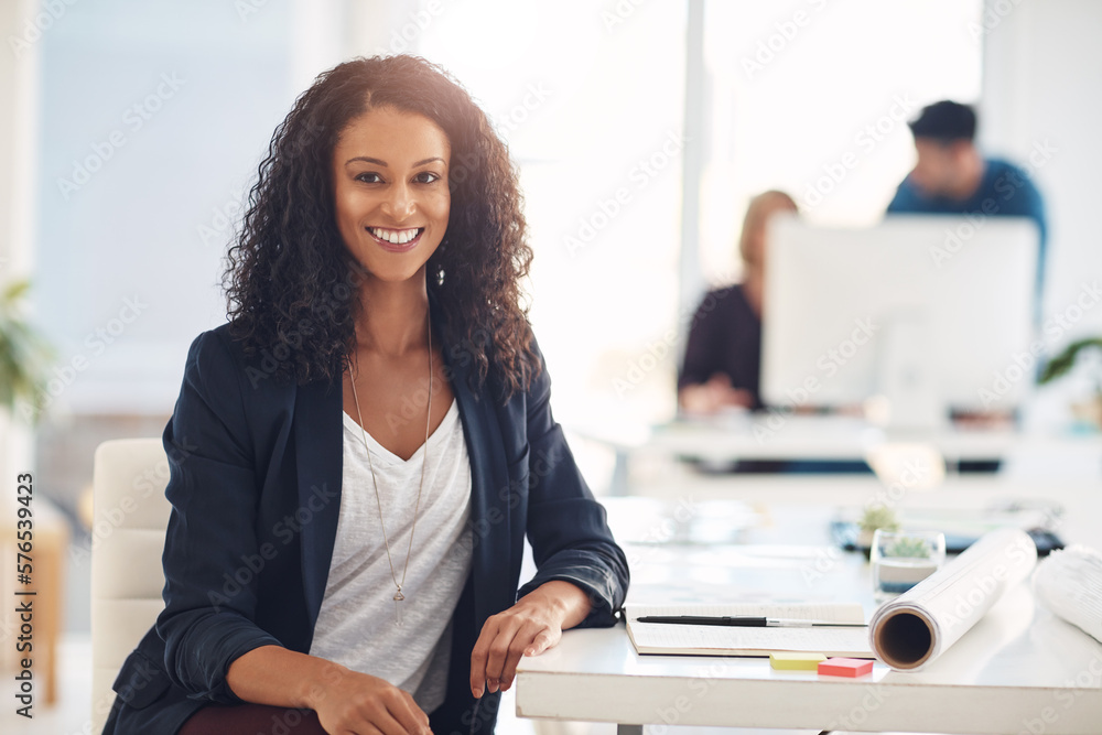 Passion put this smile on my face. Portrait of a young woman working at ...