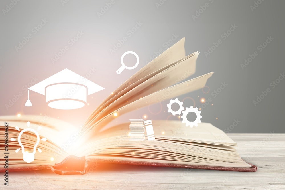 Education concept. Open book on the desk Stock Photo | Adobe Stock