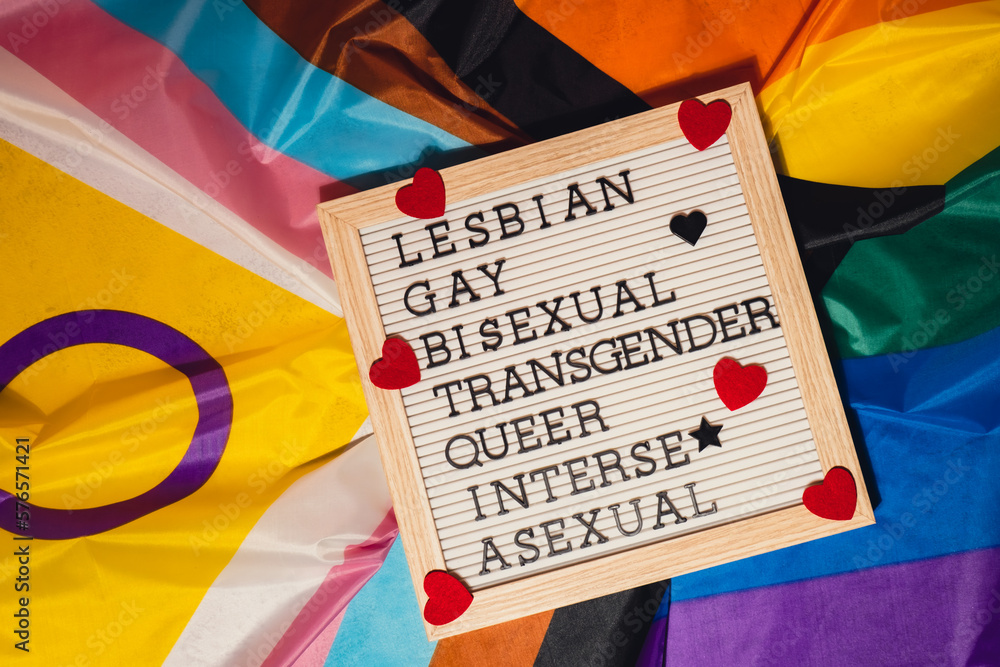 LGBTQIA description frame on Rainbow LGBTQIA flag made from silk ...