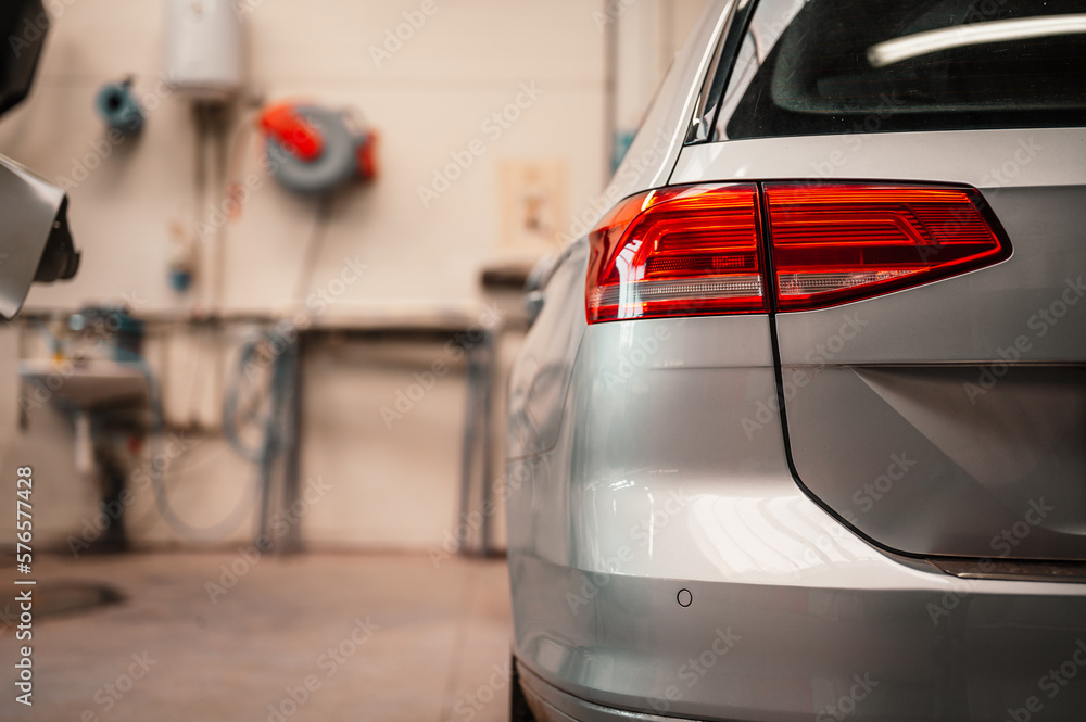 Foto de Modern red car parking in the car service. Close up. Headlights ...