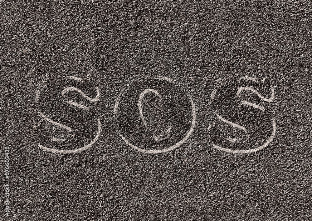 SOS written on a concrete wall texture. Symbolic representation of ...