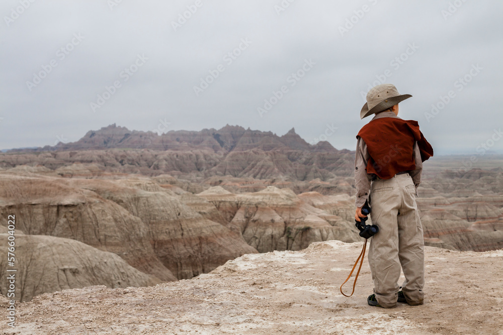 boy wearing explorer costume holding binoculars Stock Photo | Adobe Stock