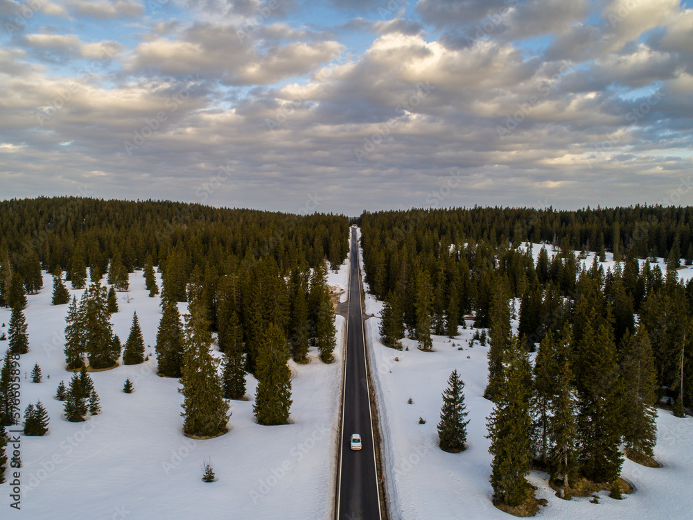 Car on road through forest in winter, Le Chenit, Vaud Canton ...
