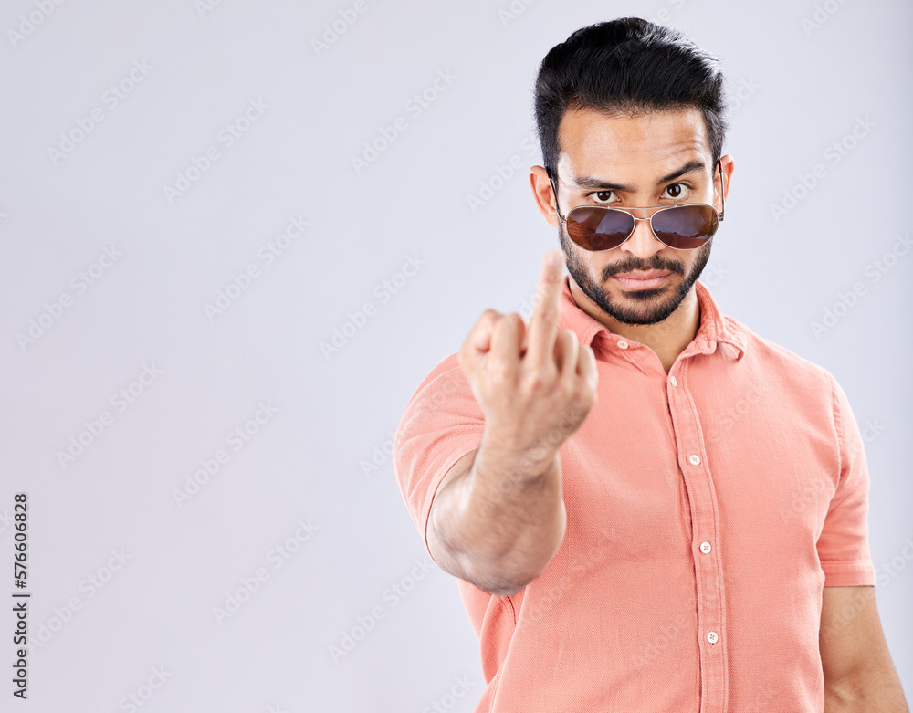 Cool, rude and portrait of an Asian man with a middle finger isolated ...