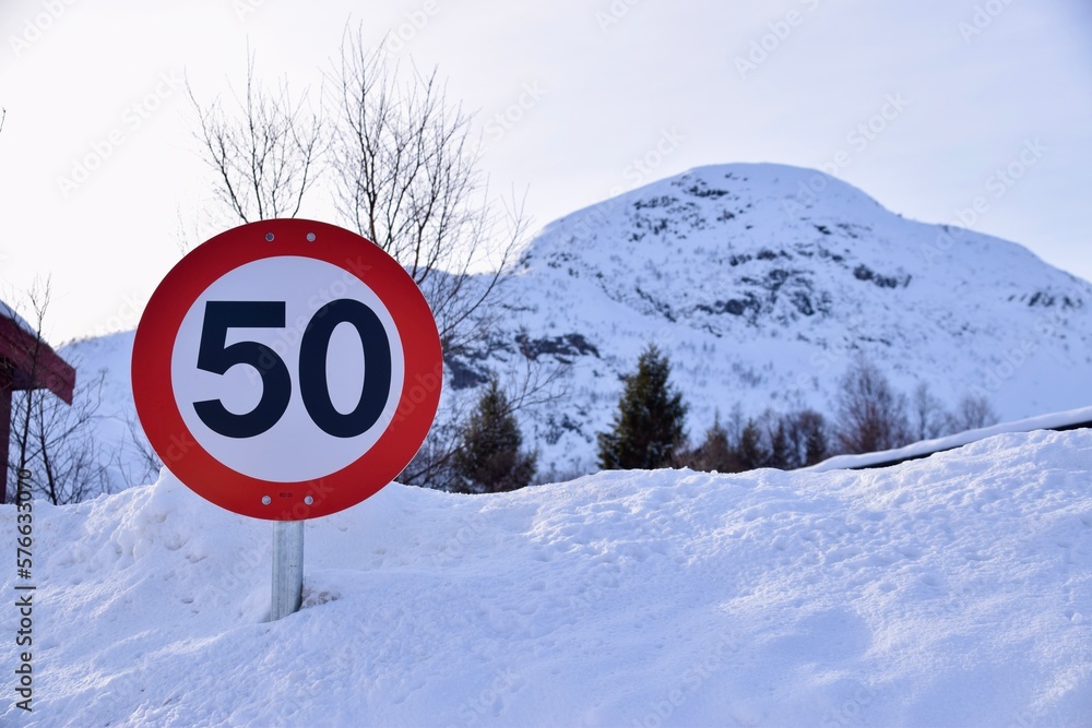 50 kph speed limit sign, Hovden, Norway. Sign against snowy hilly ...