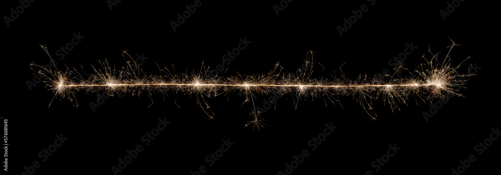 Sparkling burning creative golden line written with burning sparklers ...