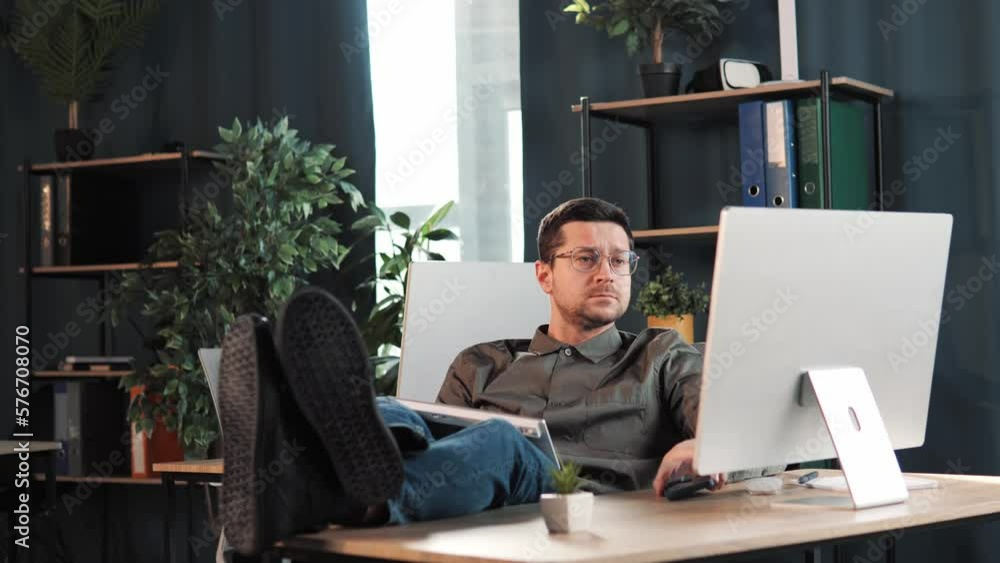 Happy relax handsome male boss leader manager sitting at office desk ...