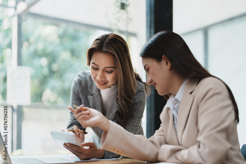 Financial analysts analyzing business reports on planned investment ...