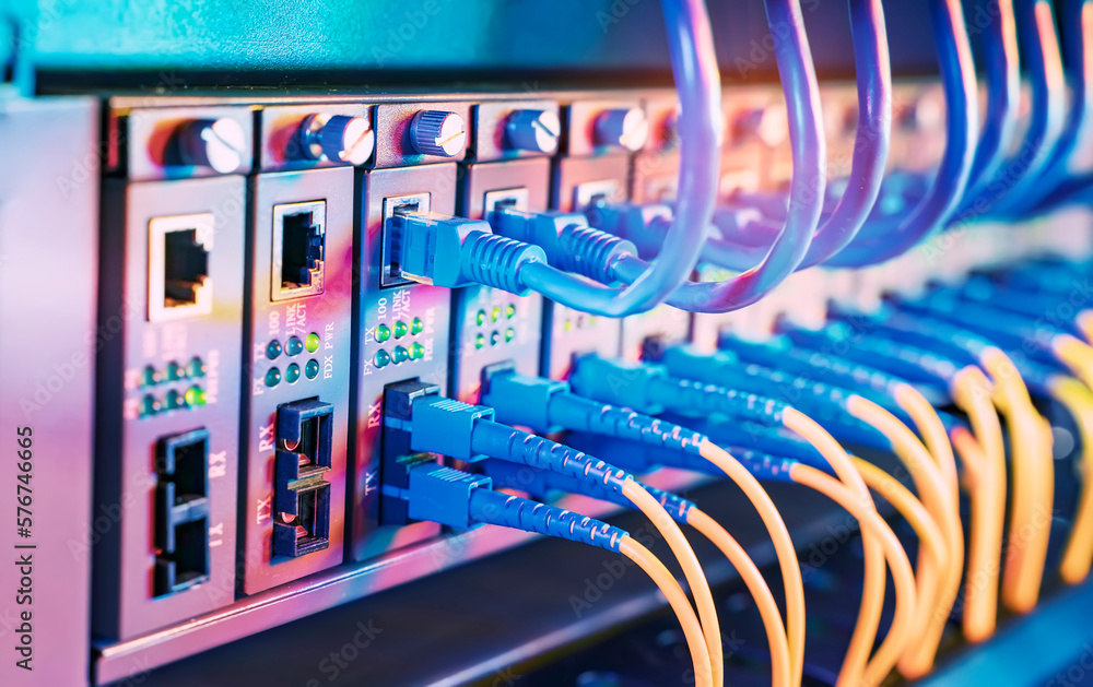 Fiber Optical cables connected to an optic ports and Network cables ...