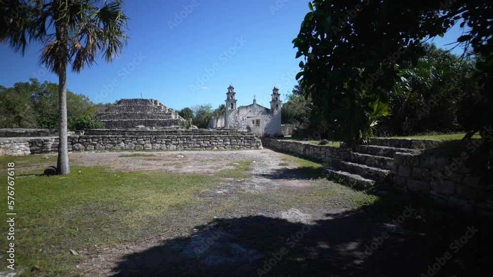 Camera pushing in to the catholic church showing the original mayan ...