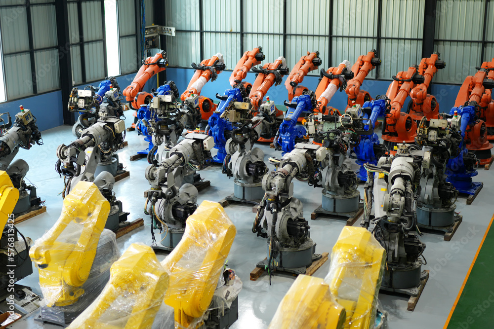 Foto de Robotic arm in futuristic assembly manufacturing factory, in ...