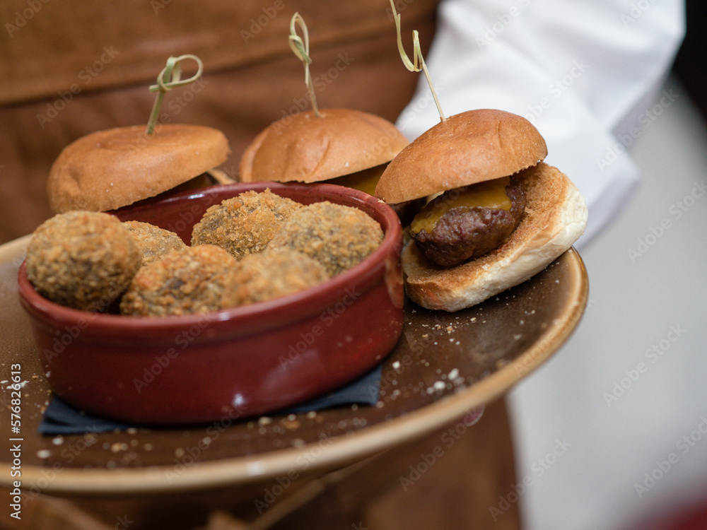 Mini burgers and haggis balls canapes on a plate close up Stock Photo ...
