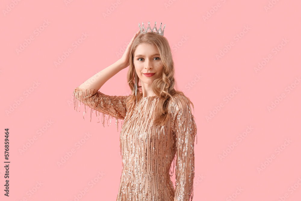 Teenage girl in crown and shiny prom dress on pink background Stock ...