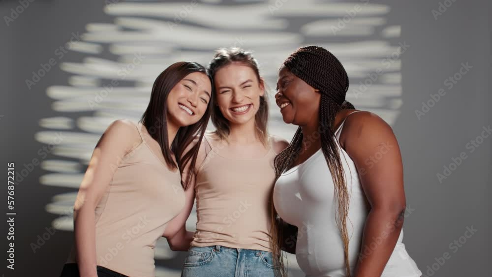 Group of diverse girls feeling positive about body types, laughing and ...