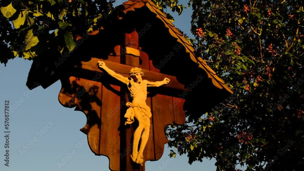 Vídeo do Stock: Jesus Christ on the cross in blooming chestnut trees ...