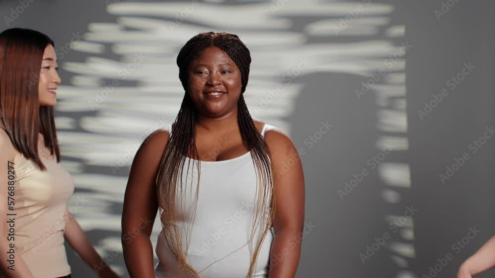 Group of multiracial women smiling for body positivity ad, curvy and ...