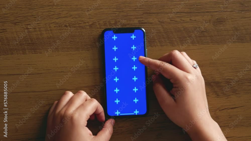 Tracking markers, green screen and phone screen with hands of woman for ...