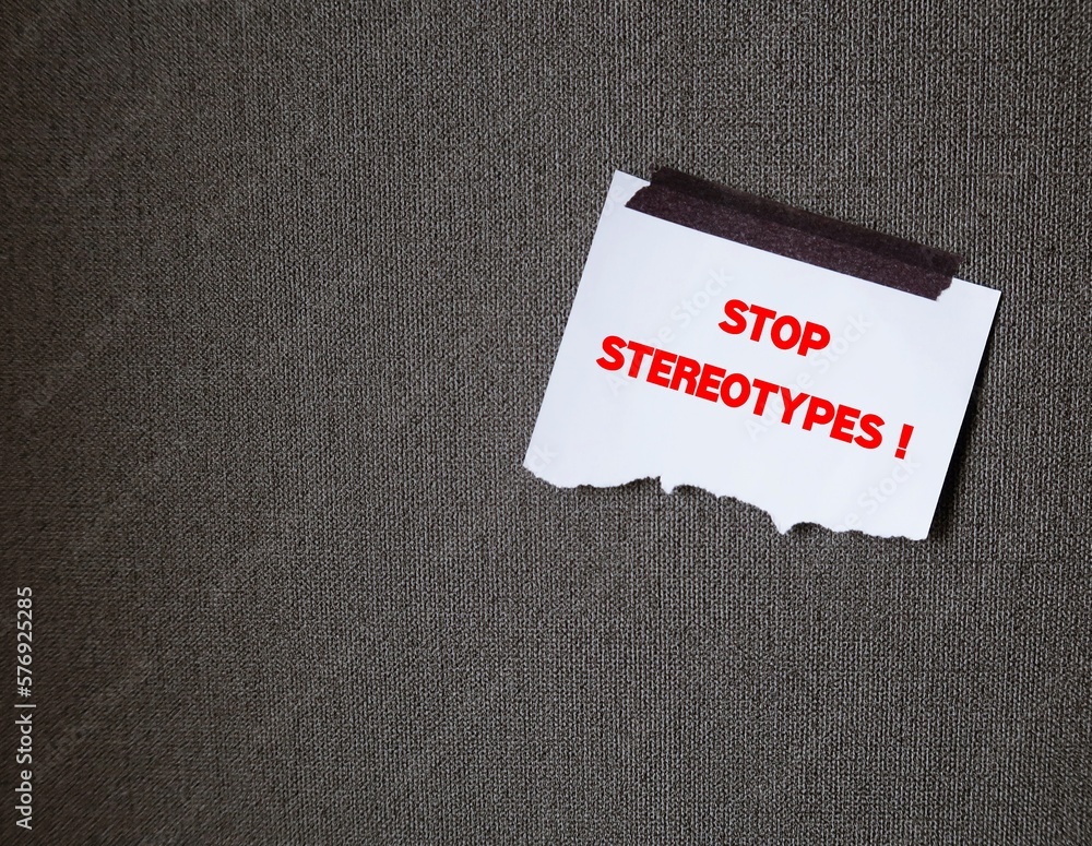 White torn paper stick on office wall background with text message ...