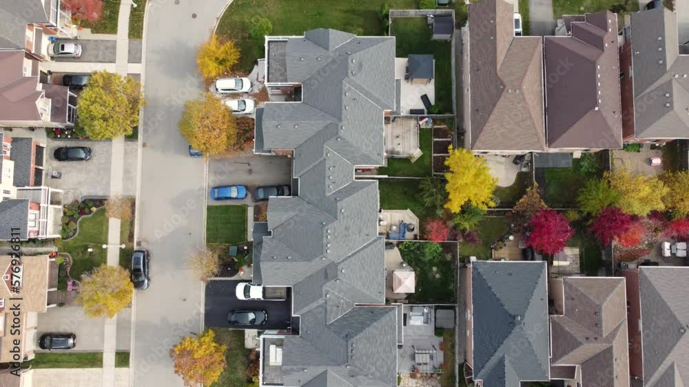 An overhead aerial view of houses and homes that are part of a ...
