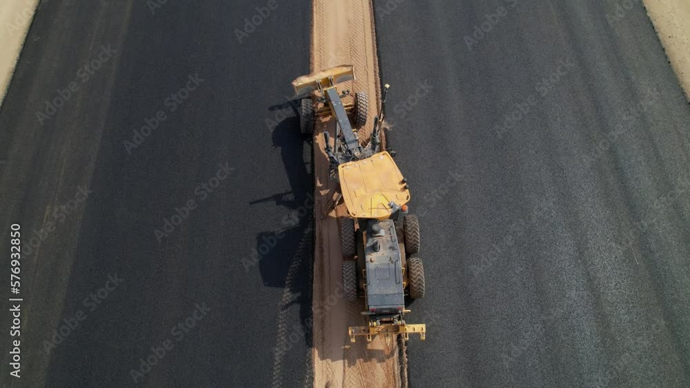 Video Stock Road construction grader top view. Aerial shot ...