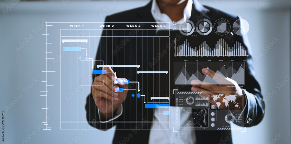 Businessman hand Project manager working and update tasks and Gantt ...