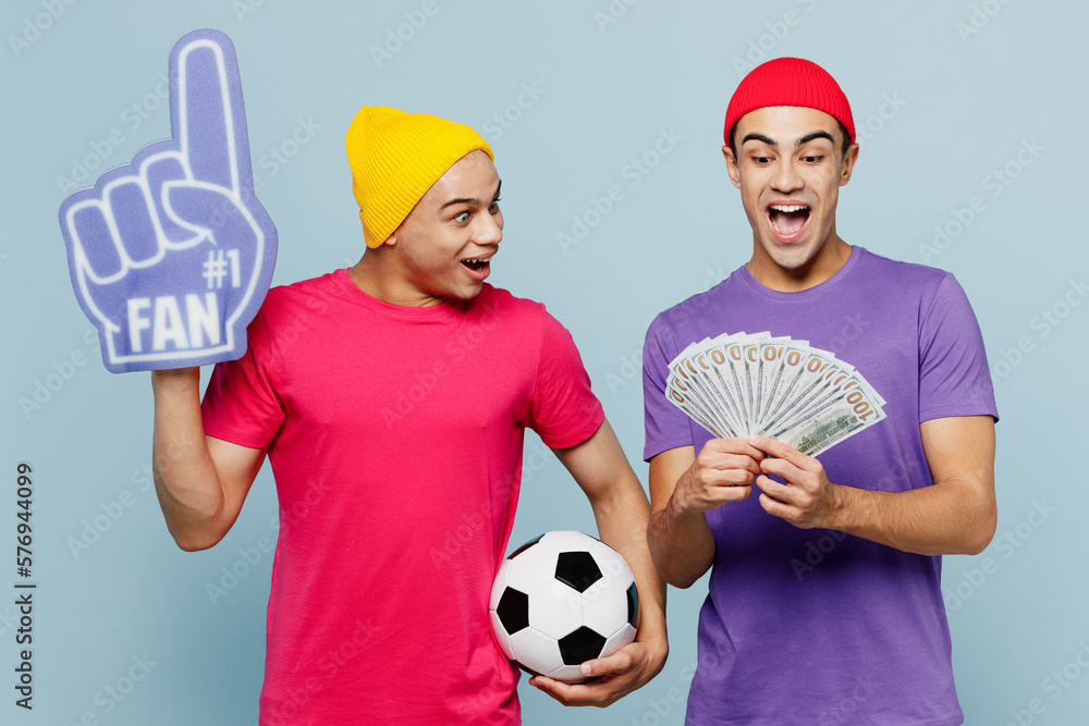 Young cool fans couple two friend men wear casual clothes foam 1 fan ...
