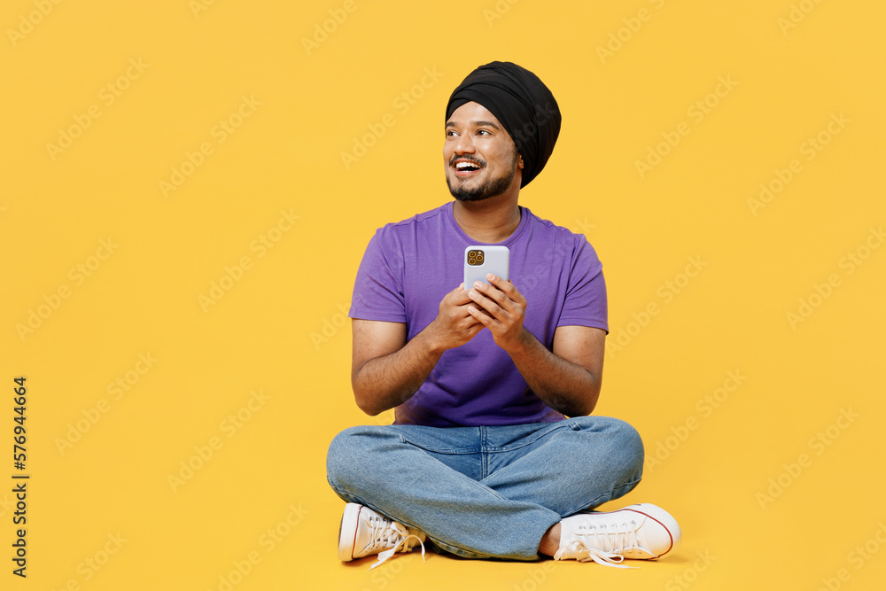 Full body fun devotee Sikh Indian man ties his traditional turban ...