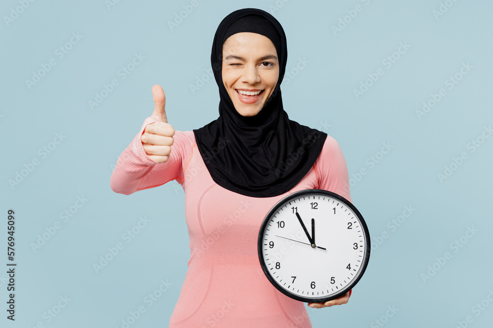 Young arabian asian muslim fitness trainer sporty woman wear pink abaya ...