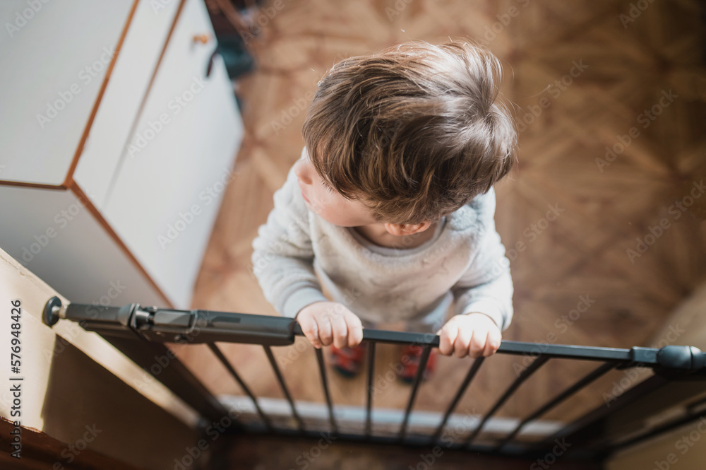 Front view of a little boy standing on the other side of the child ...