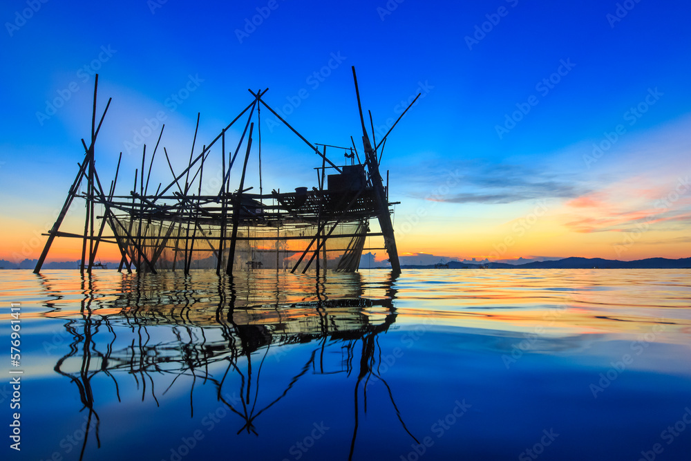 Silhouette of the traditional fishing structure built with bamboo called Bagang, typical of ...