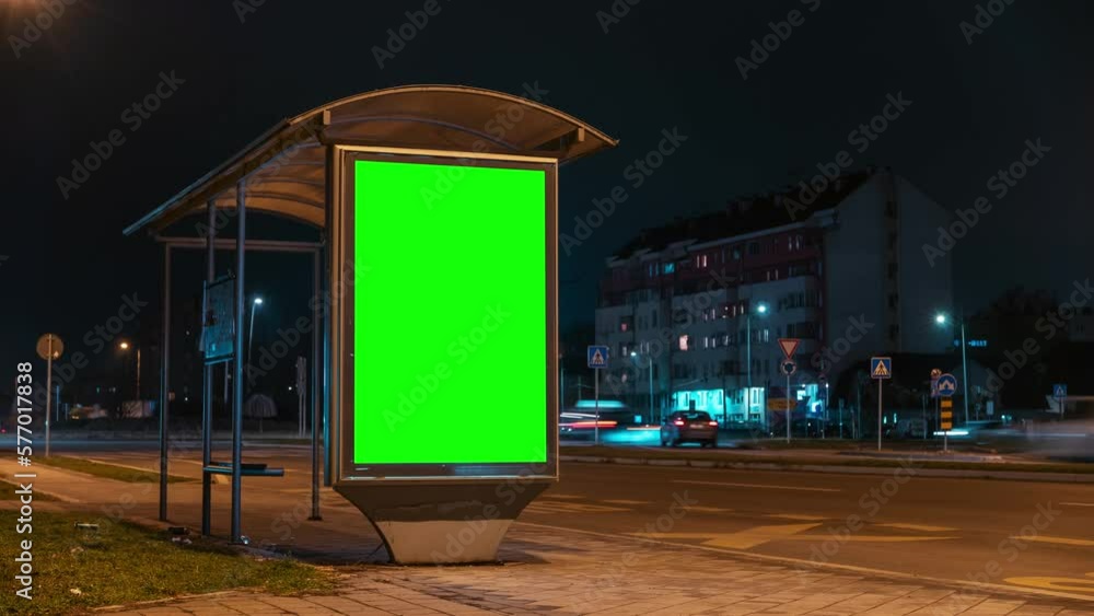 City street bus stop advertising billboard green screen mockup at night ...