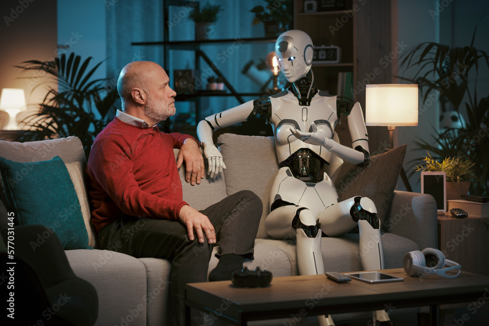 Senior man and AI robot talking together at home Stock Photo | Adobe Stock