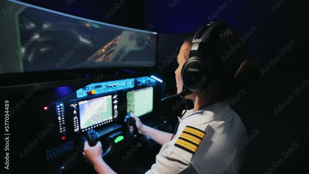 Back view of pilot holding, turning wheel, launching aircraft. Woman ...
