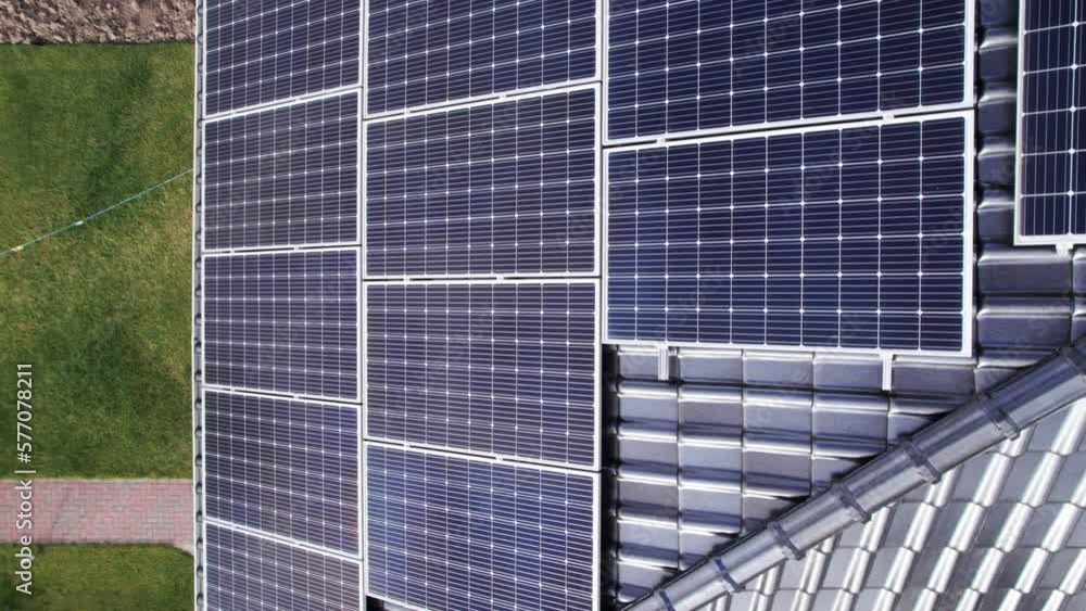 Aerial drone video of building rooftop with solar panel electric system ...