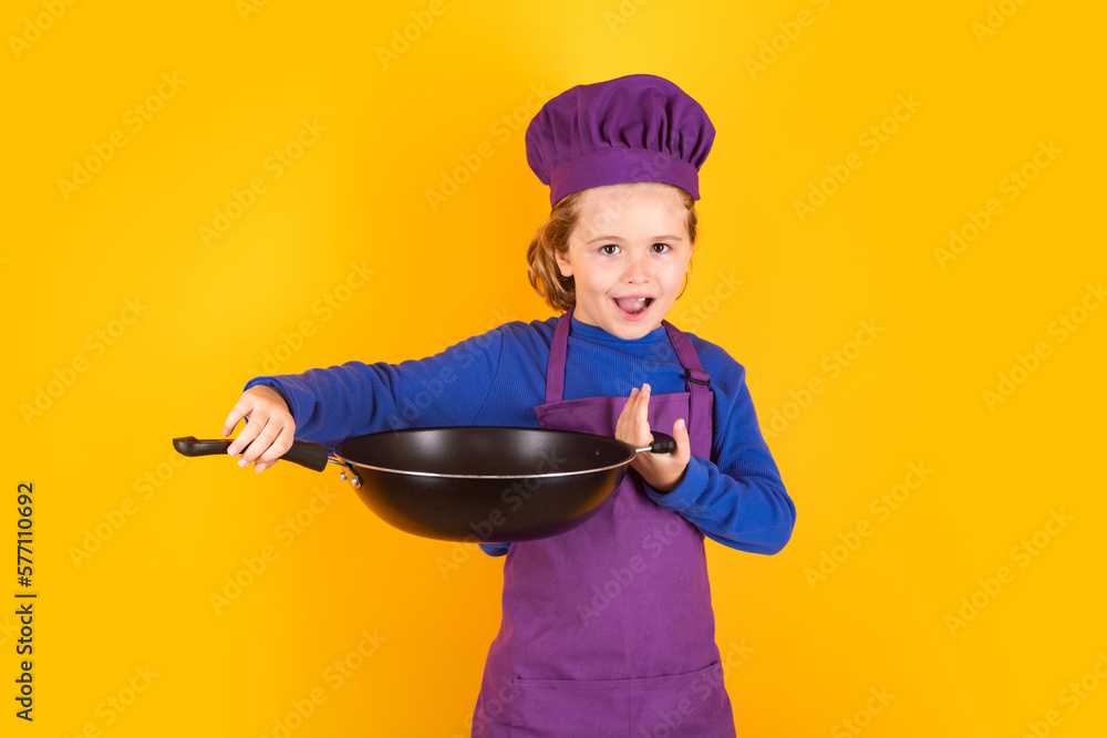 Kid boy chef cook with cooking pan. Chef child preparing healthy food ...