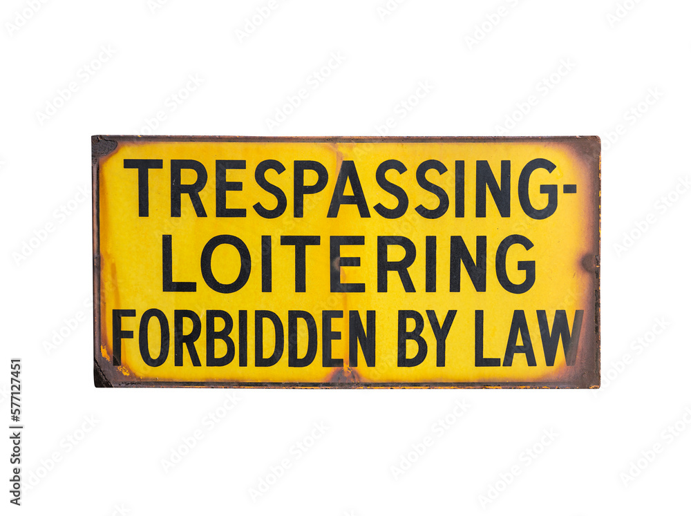 Rusty old trespassing and loitering forbidden by law sign. Isolated ...