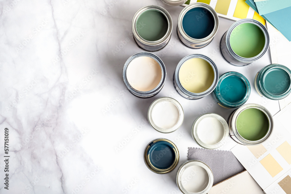 Tiny sample paint cans during house renovation, process of choosing ...