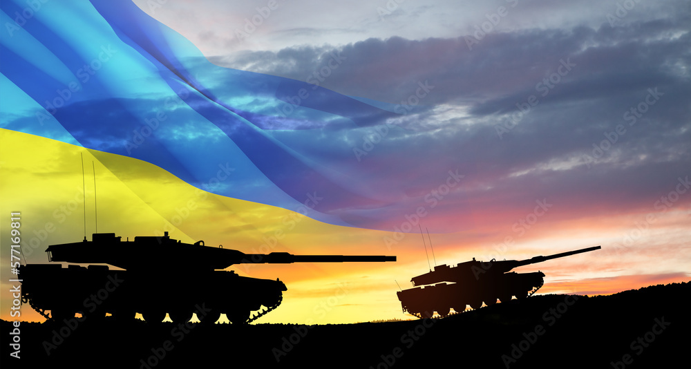 Silhouettes of army tanks at sunset sky background with Ukrainian flag ...