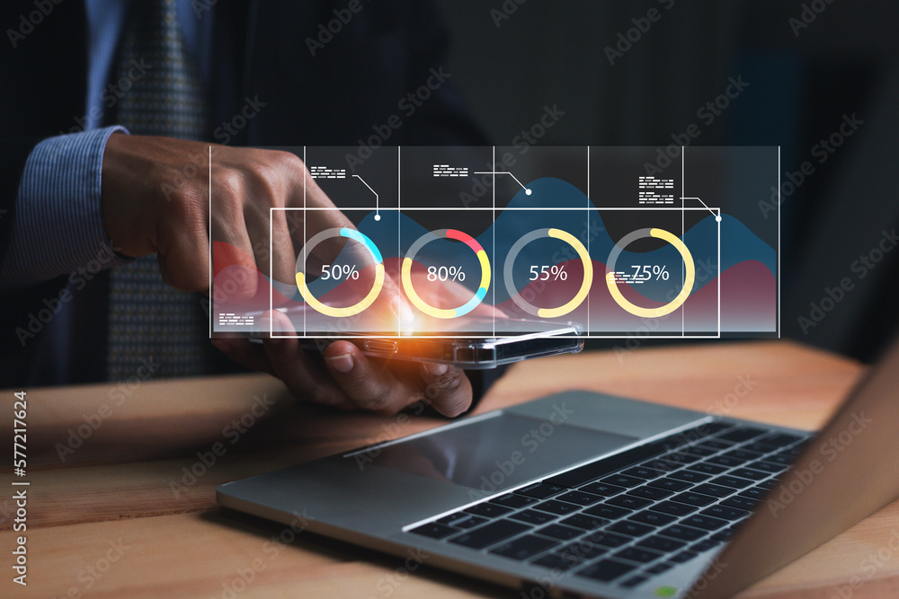 Businessman holding tablet and showing a growing virtual hologram of ...