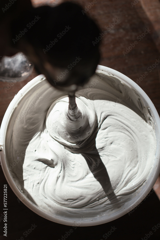 Plaster compound mixed in a 5 gallon bucket, home renovation theme ...