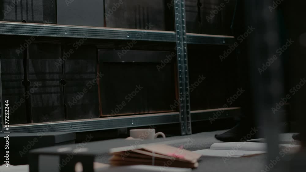 Criminal detective examining surveillance photos clues, analyzing ...