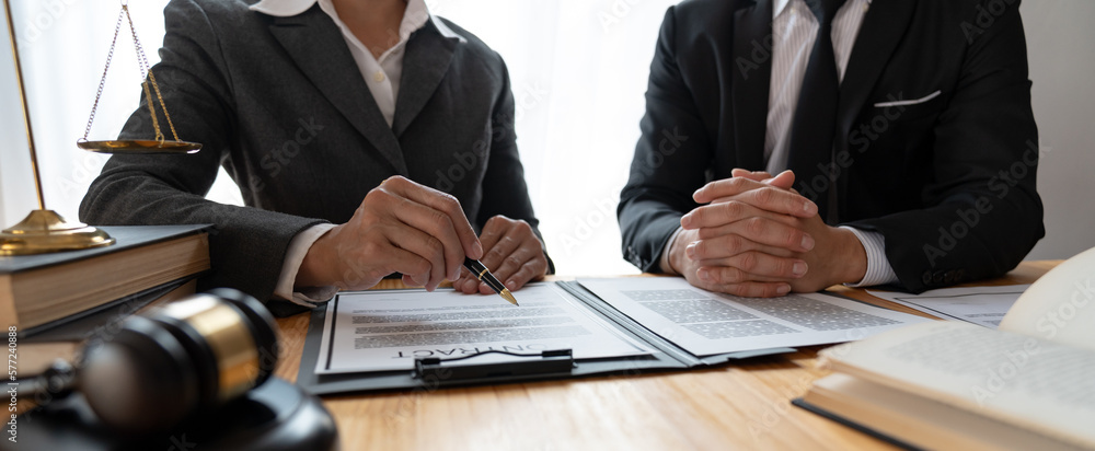 Lawyer, legal advisor, businessman brainstorming clarifying agreement ...