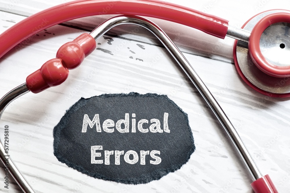 Medical errors inscription on torn paper with stethoscope on white ...