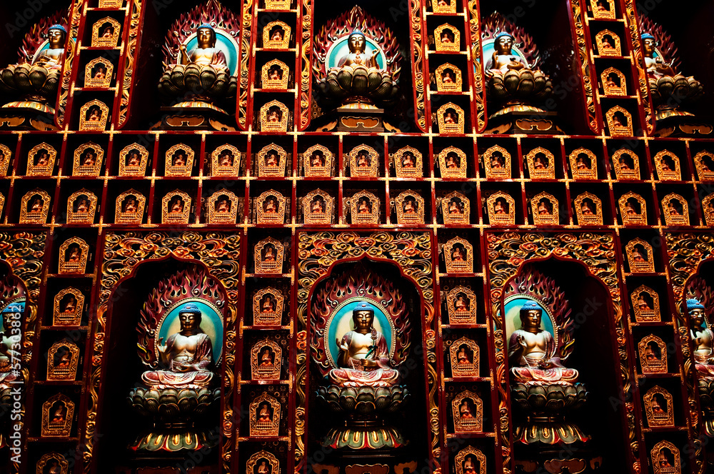 Buddha covers the walls at the Buddha Tooth Relic Temple and Museum in ...