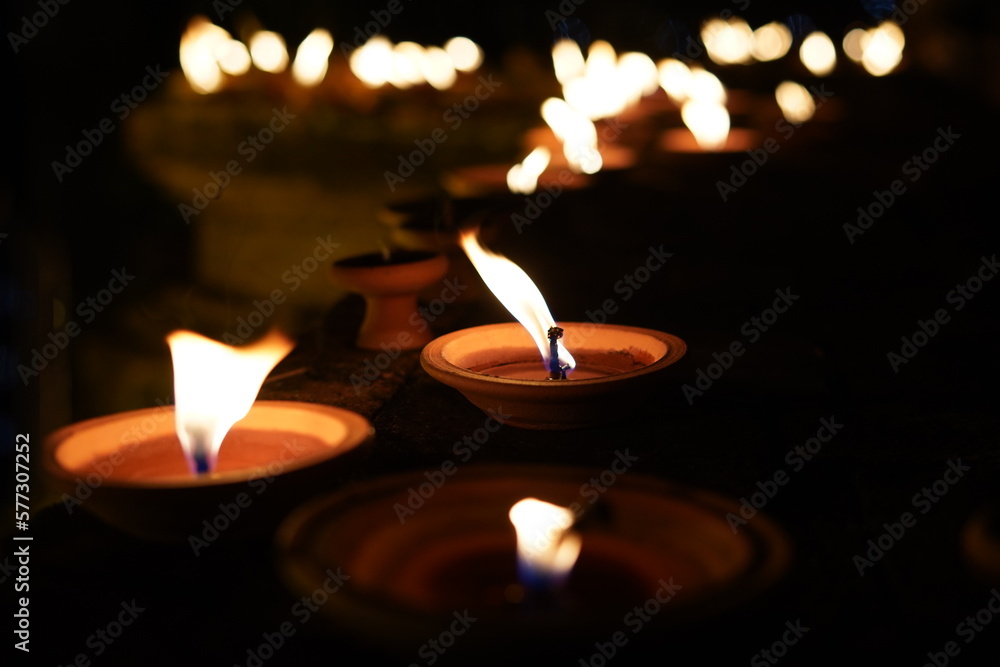lighing candle small bowls to worship and respect individual religious ...