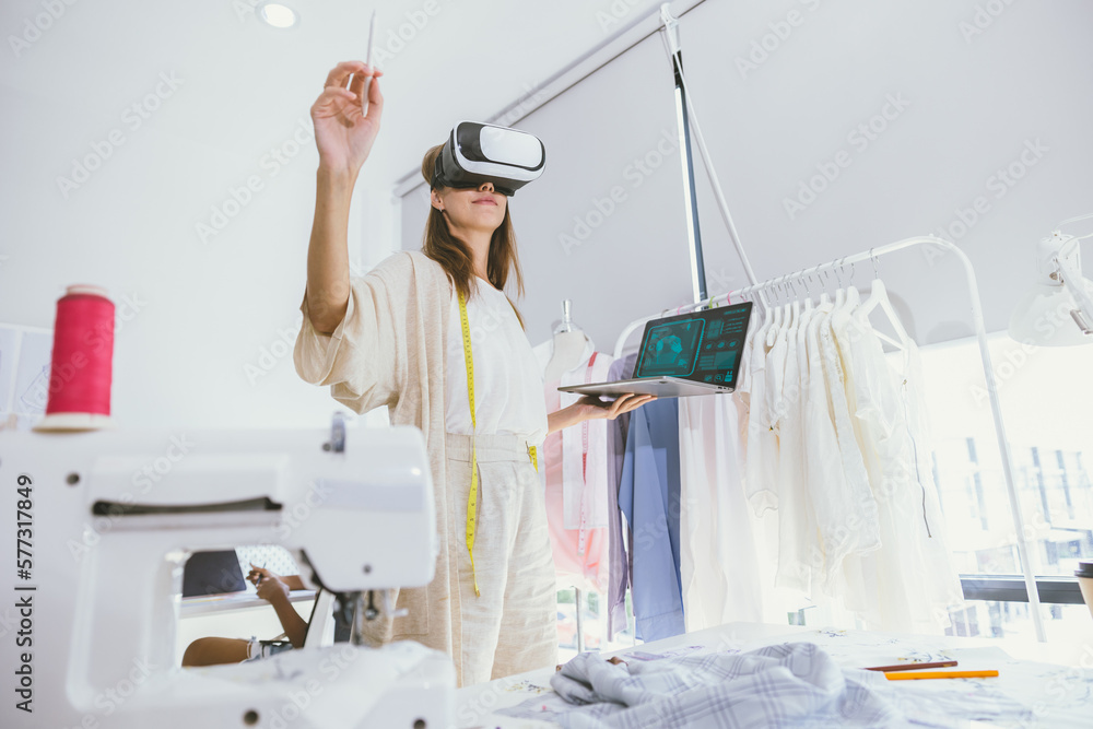 Costume designer using modern VR visual digital design technology in ...