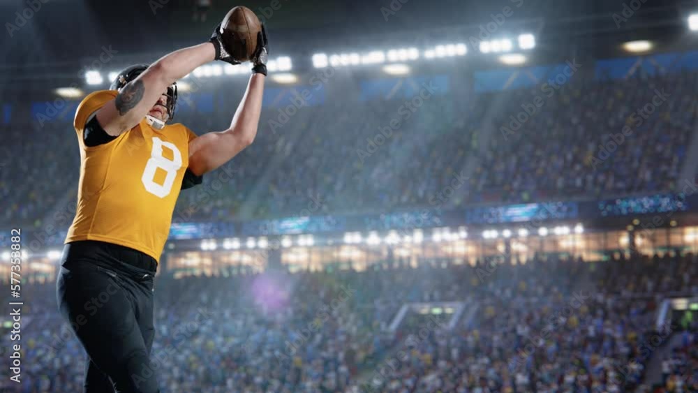 Aesthetic Shot of American Football Player Catching A Ball Mid-Air on ...