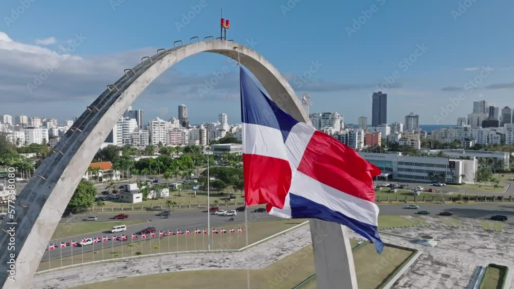 Slow-motion of Dominican Republic flag waving over triumphal arch in ...