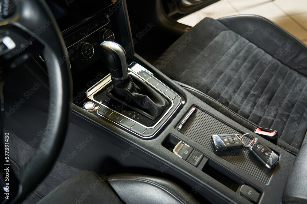 car keys are on the center console. glove box closed with a curtain ...